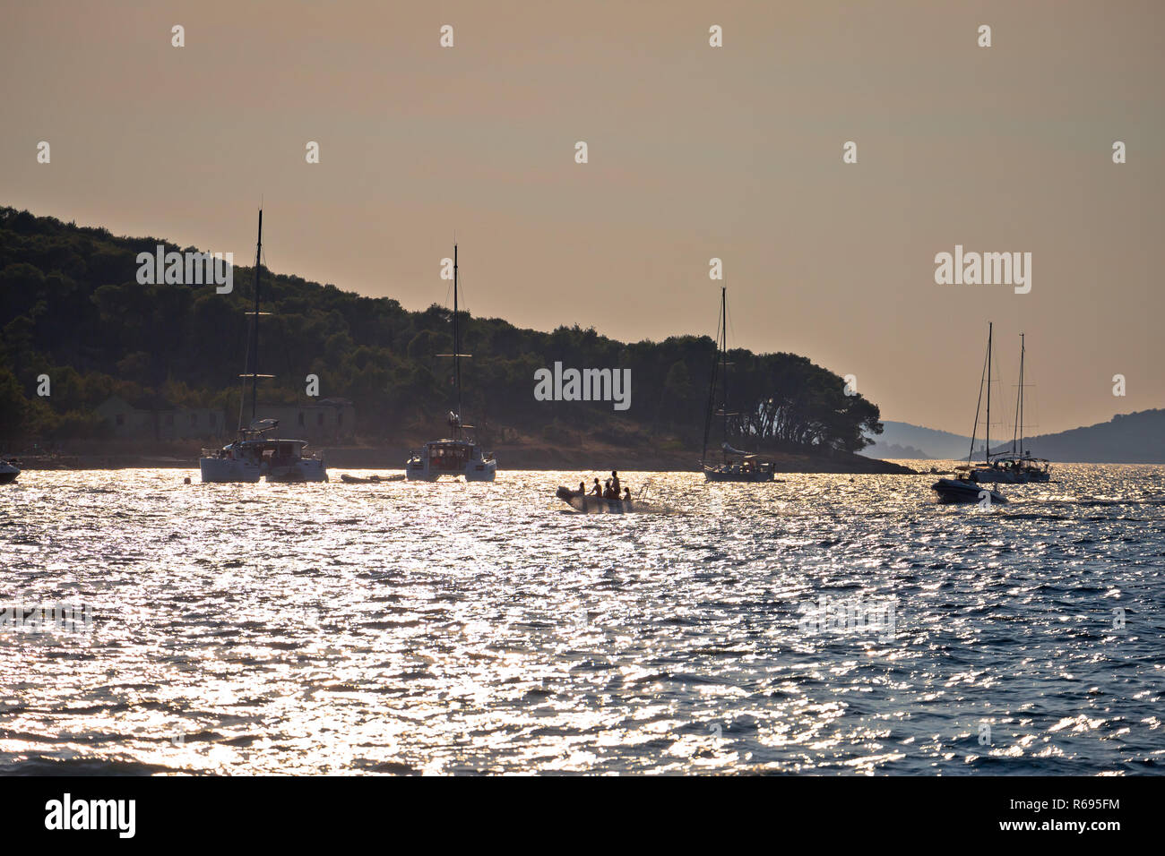 Island of Zlarin sailing bay at sunset view Stock Photo - Alamy