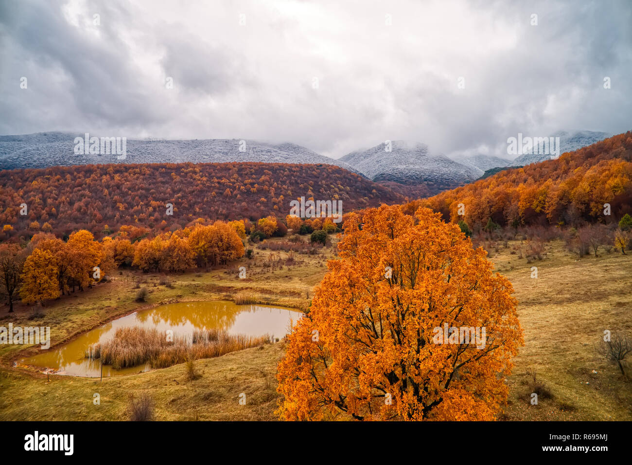 Two seasons - winter and autumn scene in the area of Vermio in northern ...