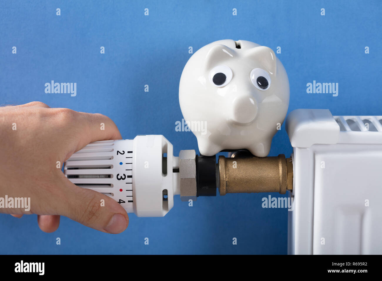 Mans hand adjusting radiator hi-res stock photography and images - Alamy