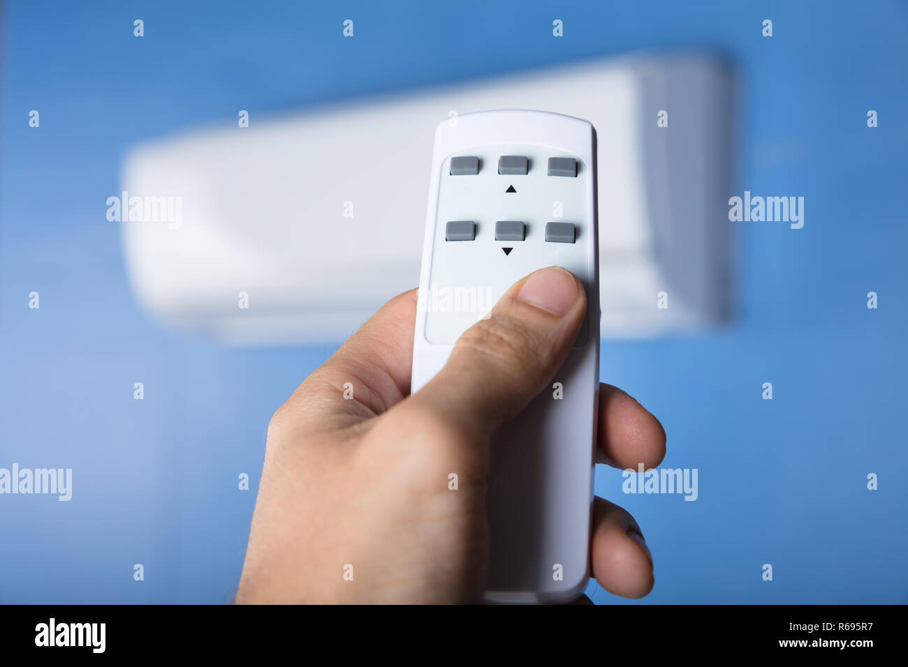 Hand Operating Air Conditioner With Remote Control Stock Photo - Alamy
