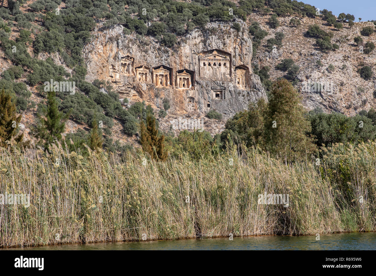 Boats view at slope of Lycians rock tombs in Dalyan Town Stock Photo ...