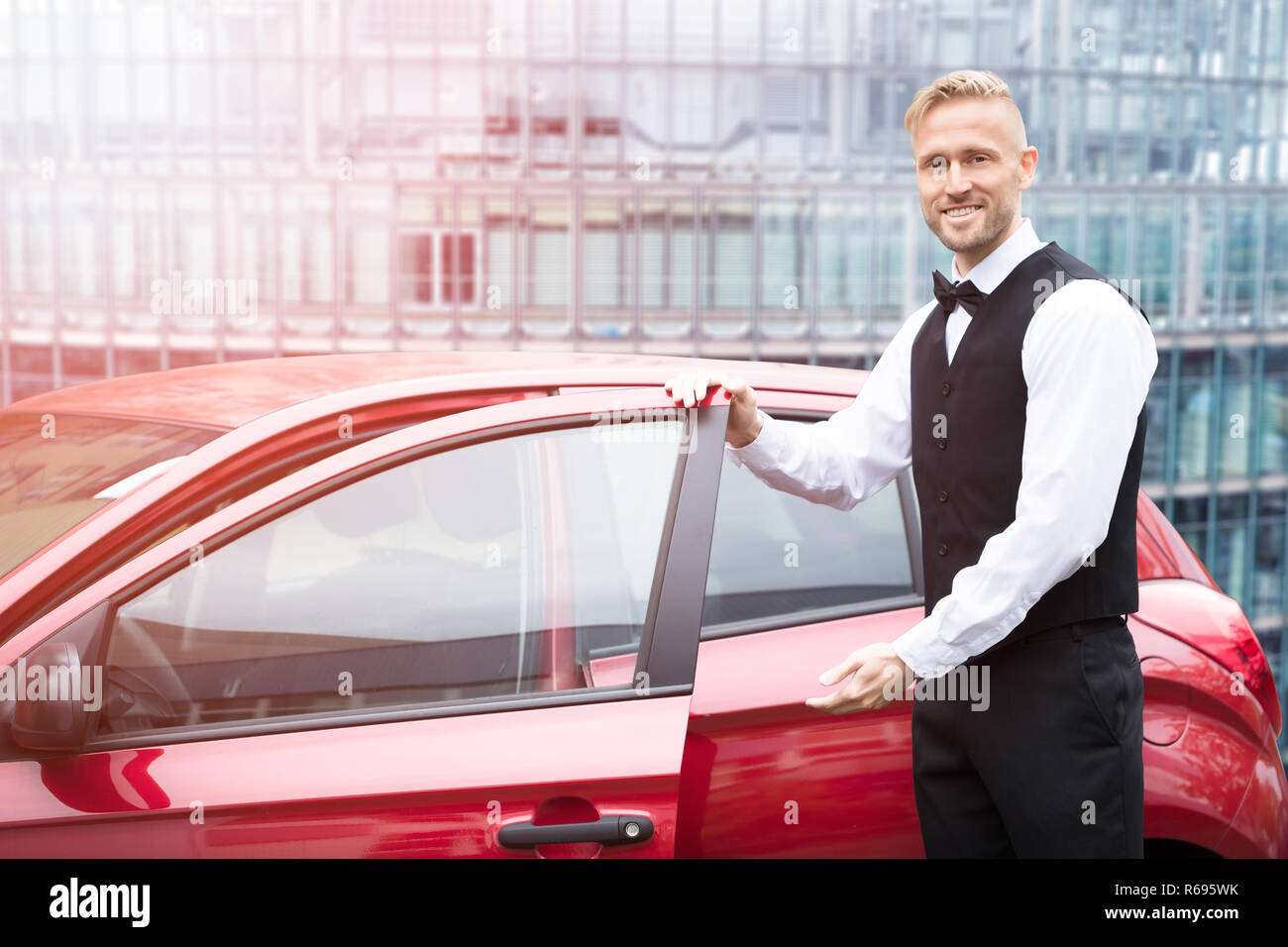 Male Valet Opening Car Door Stock Photo - Alamy