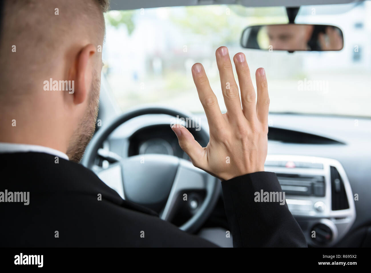 Man Sitting On Self Drive Car Seat Stock Photo - Alamy