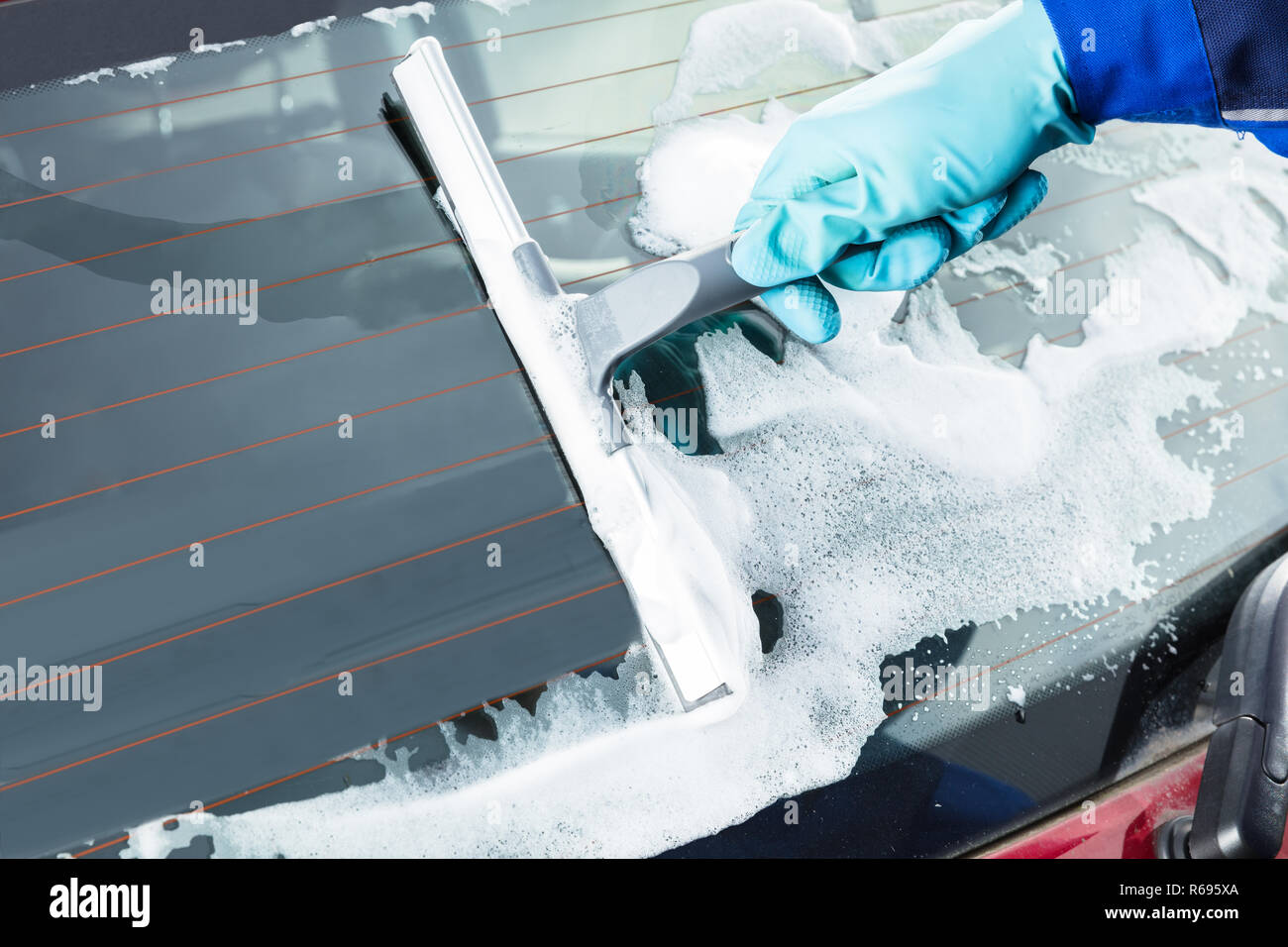 Person's Hand Washing Rear Windshield Stock Photo - Alamy