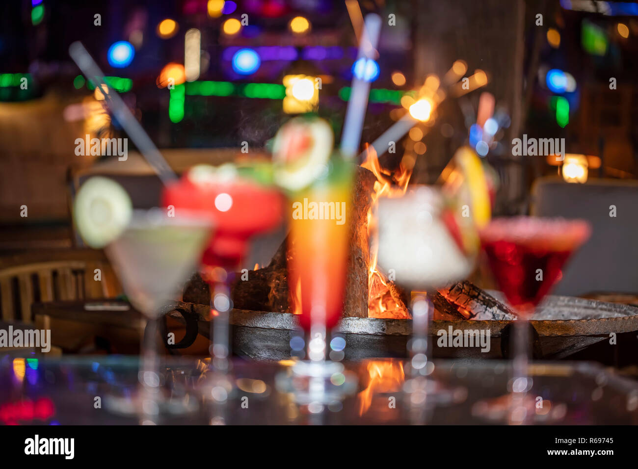 Alcoholic cocktail row on bar table, colorful party drinks Stock Photo ...