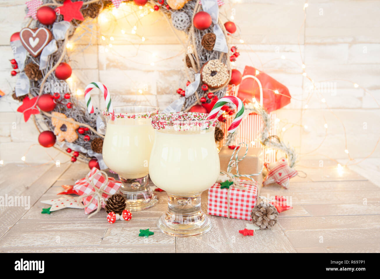 Egg Nog With Candy Canes Stock Photo - Alamy