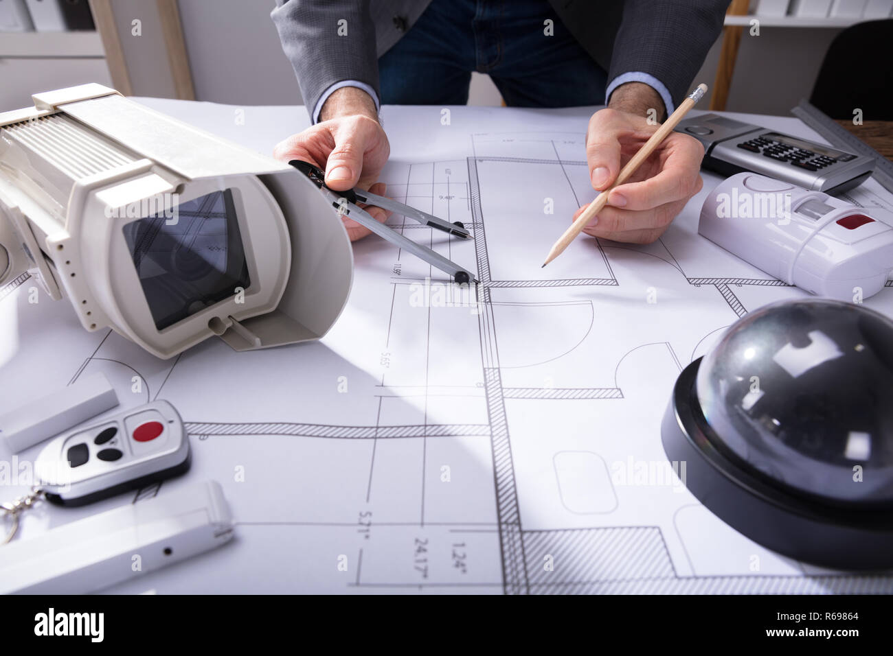 Architect Drawing Plan On Blueprint Stock Photo - Alamy
