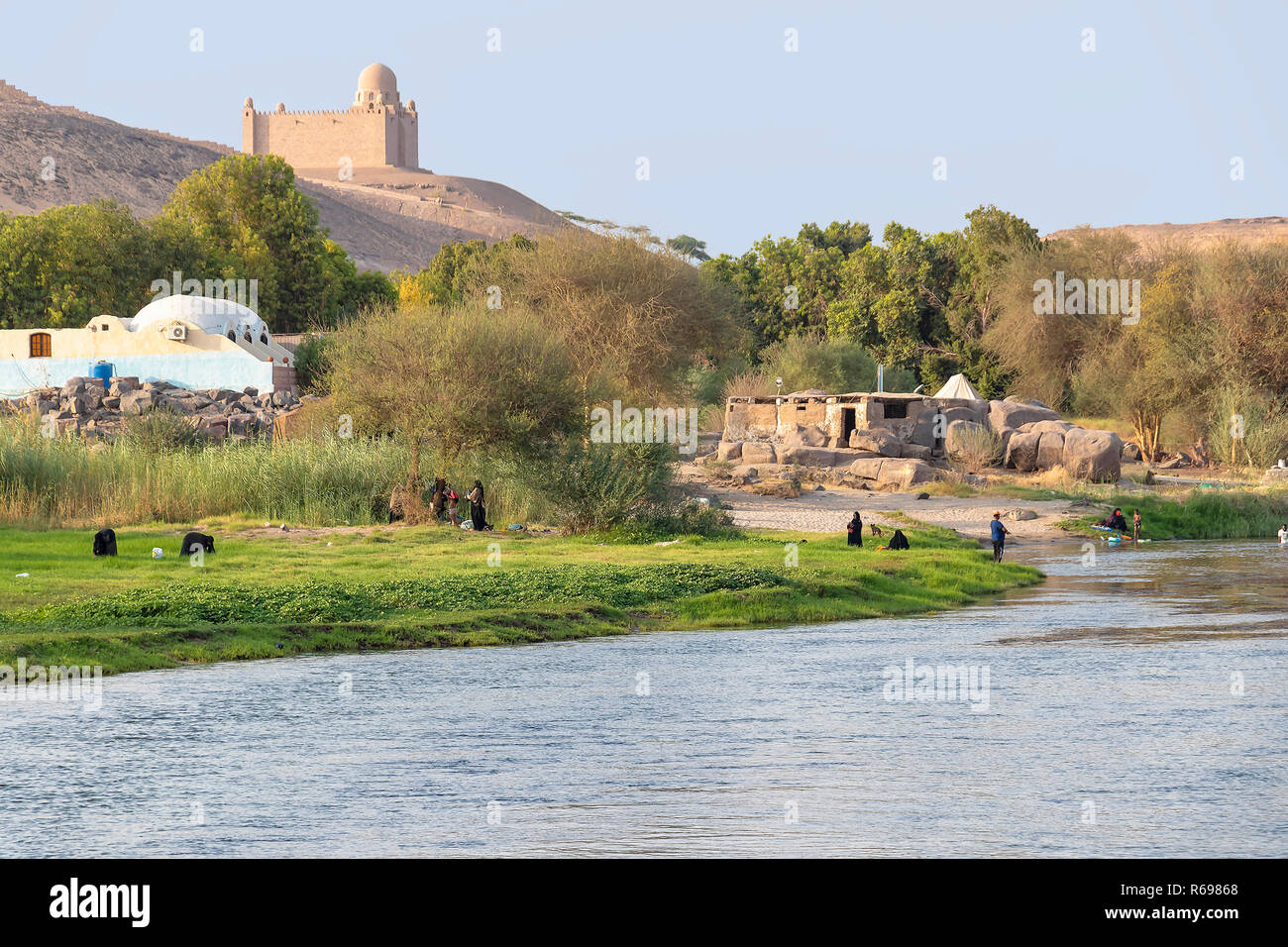 Egyptian Family enjoying of evening in the Nile river shore, Aswan ...