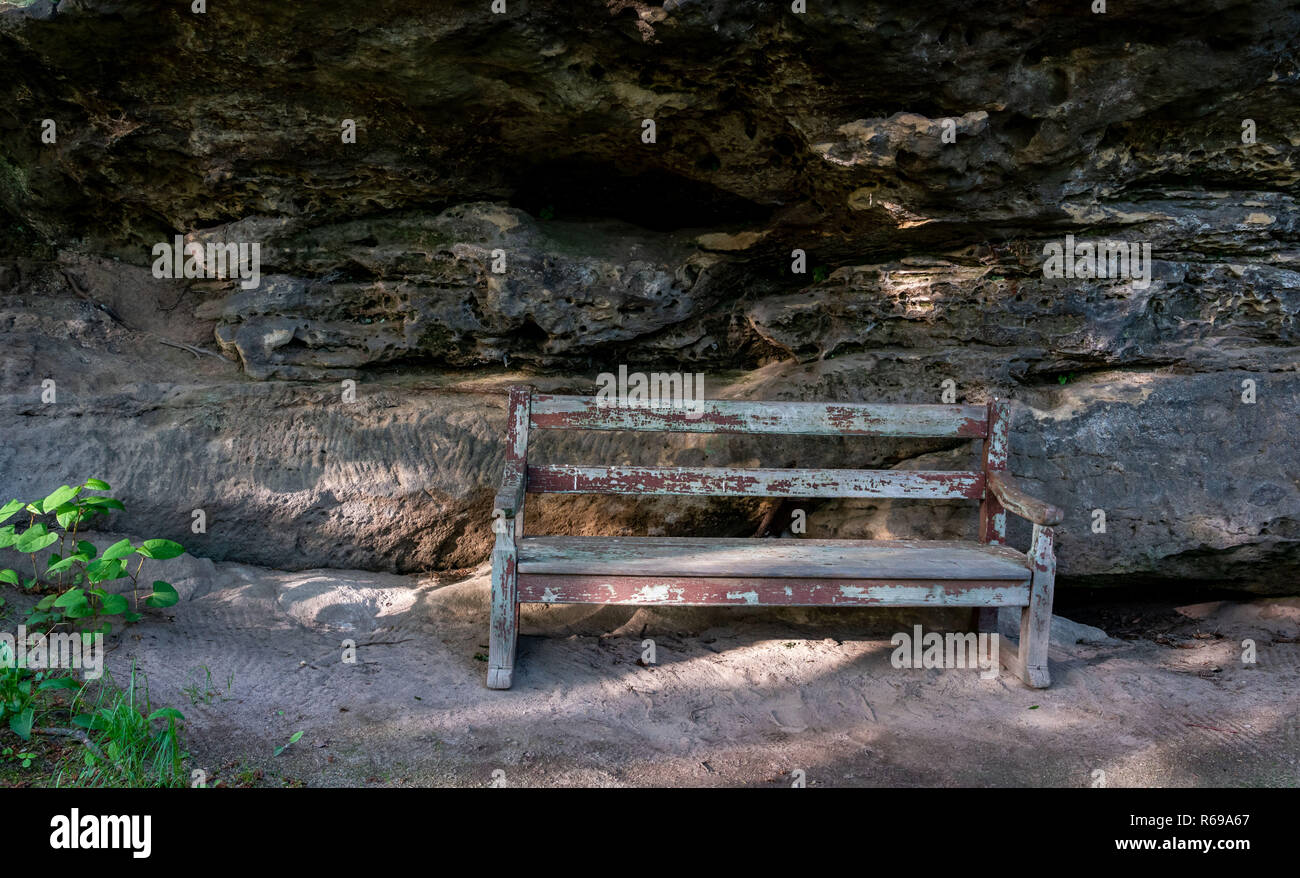 Bench Under A Rock Stock Photo - Alamy
