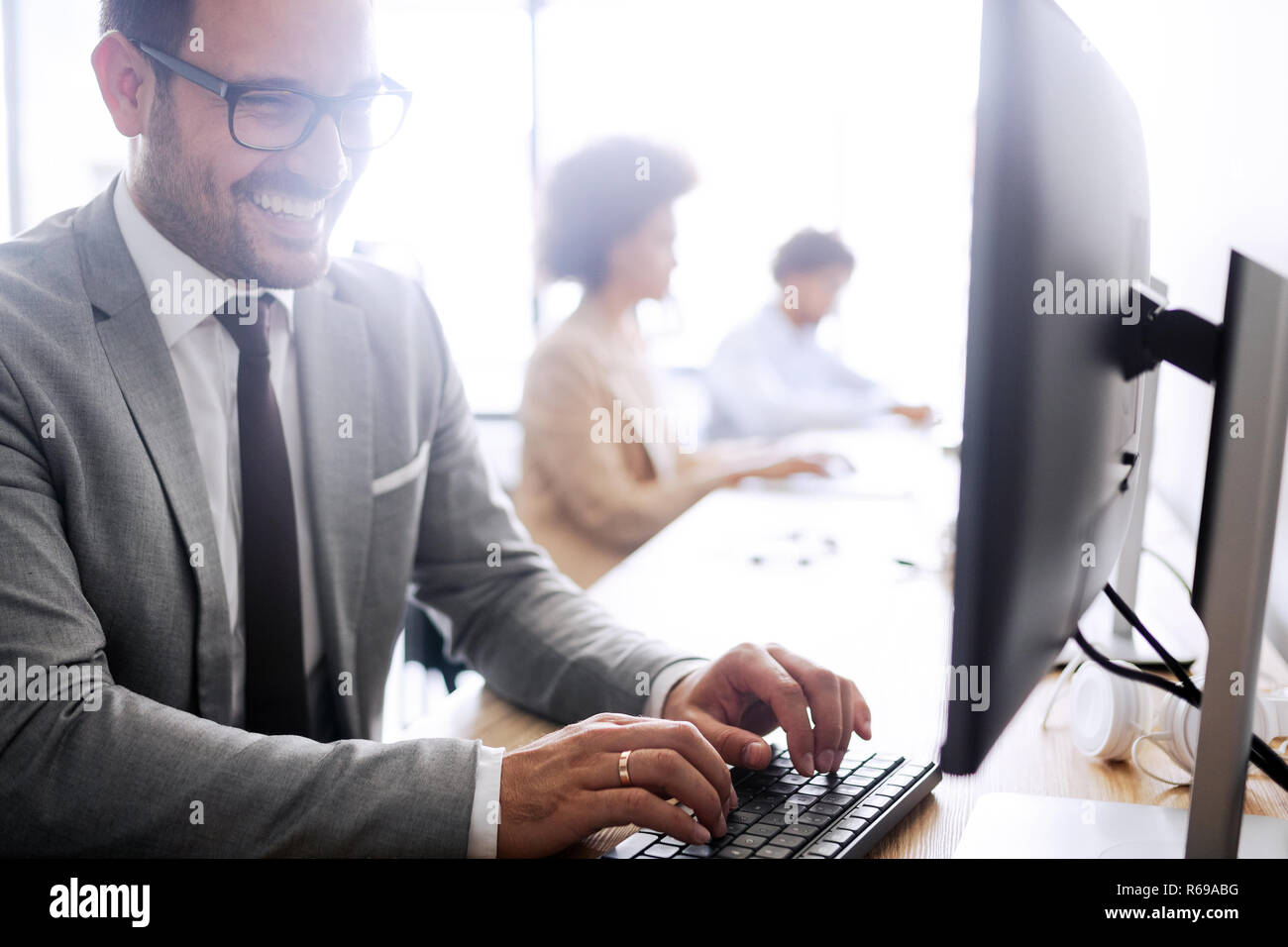 Group of successful business people at work in office Stock Photo - Alamy