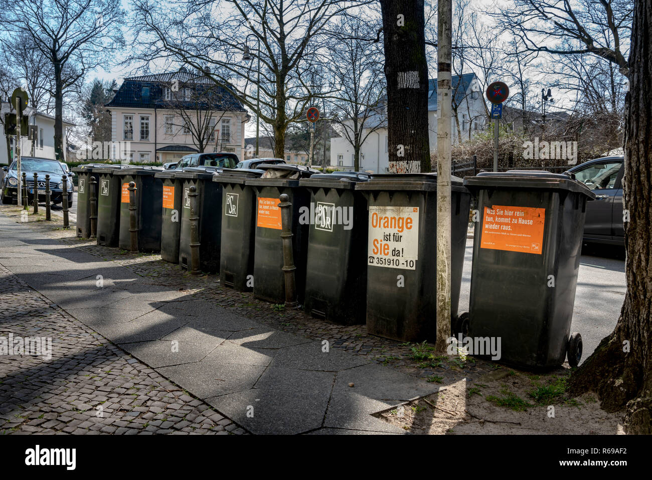 Series Of Garbage Cans On The Roadside Stock Photo - Alamy