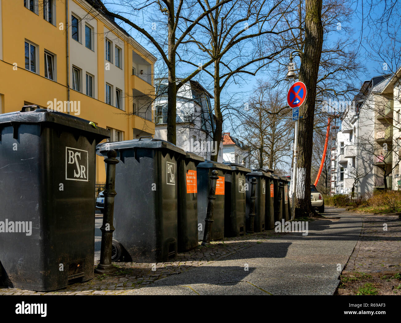 Series Of Garbage Cans On The Roadside Stock Photo - Alamy