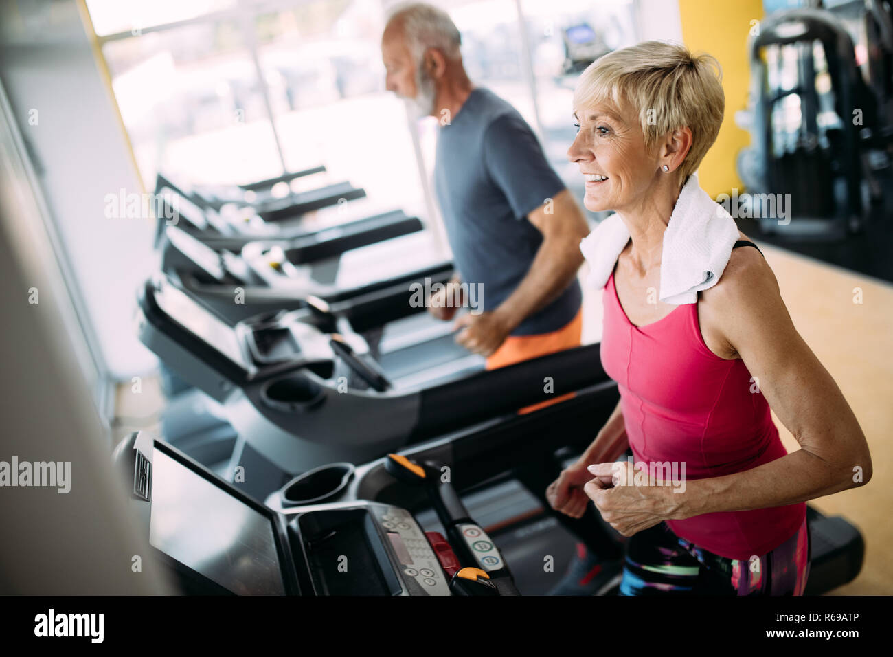 Senior people running in machine treadmill at fitness gym club Stock ...