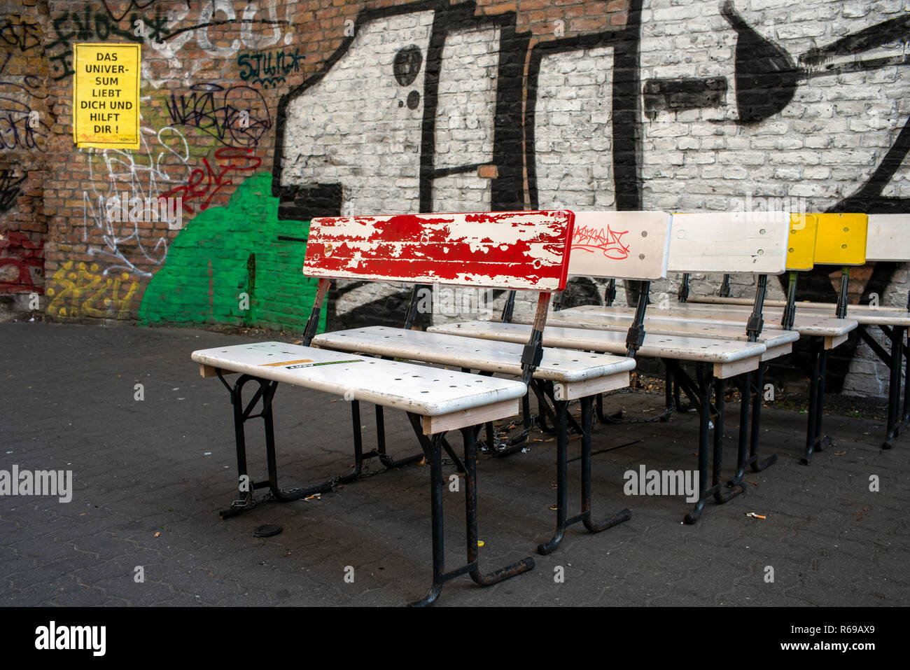 Wall Graffiti And Old Benches Stand On A Wall Stock Photo - Alamy