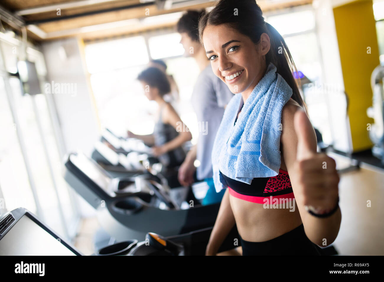 Fit people running in machine treadmill at fitness gym Stock Photo - Alamy