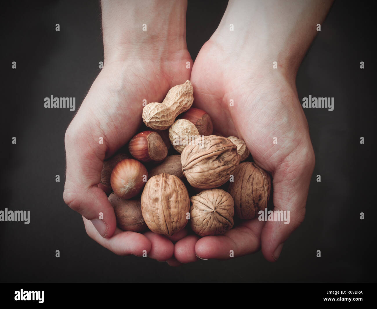 Handful of nuts hand mixed hi-res stock photography and images - Alamy