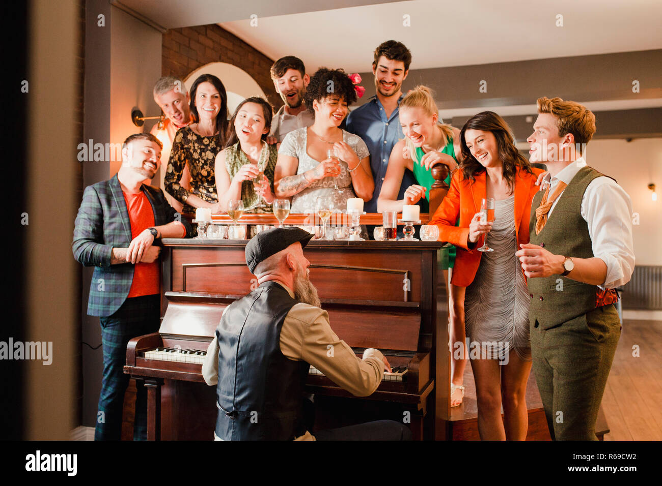 Wedding Guests Having Fun With The Pianist Stock Photo - Alamy