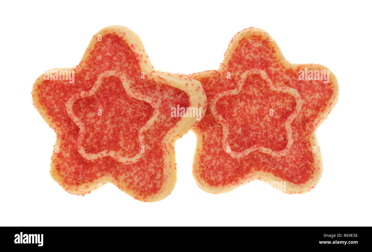 Top view of two star shaped sugar cookies with red sprinkles isolated ...