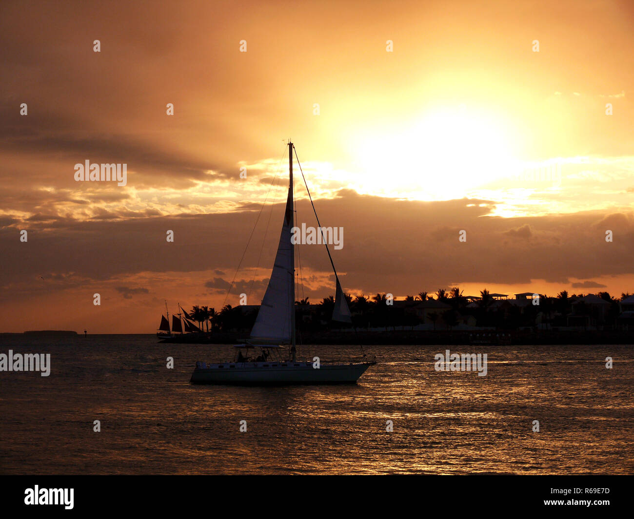 Sailing At Sunset Stock Photo - Alamy