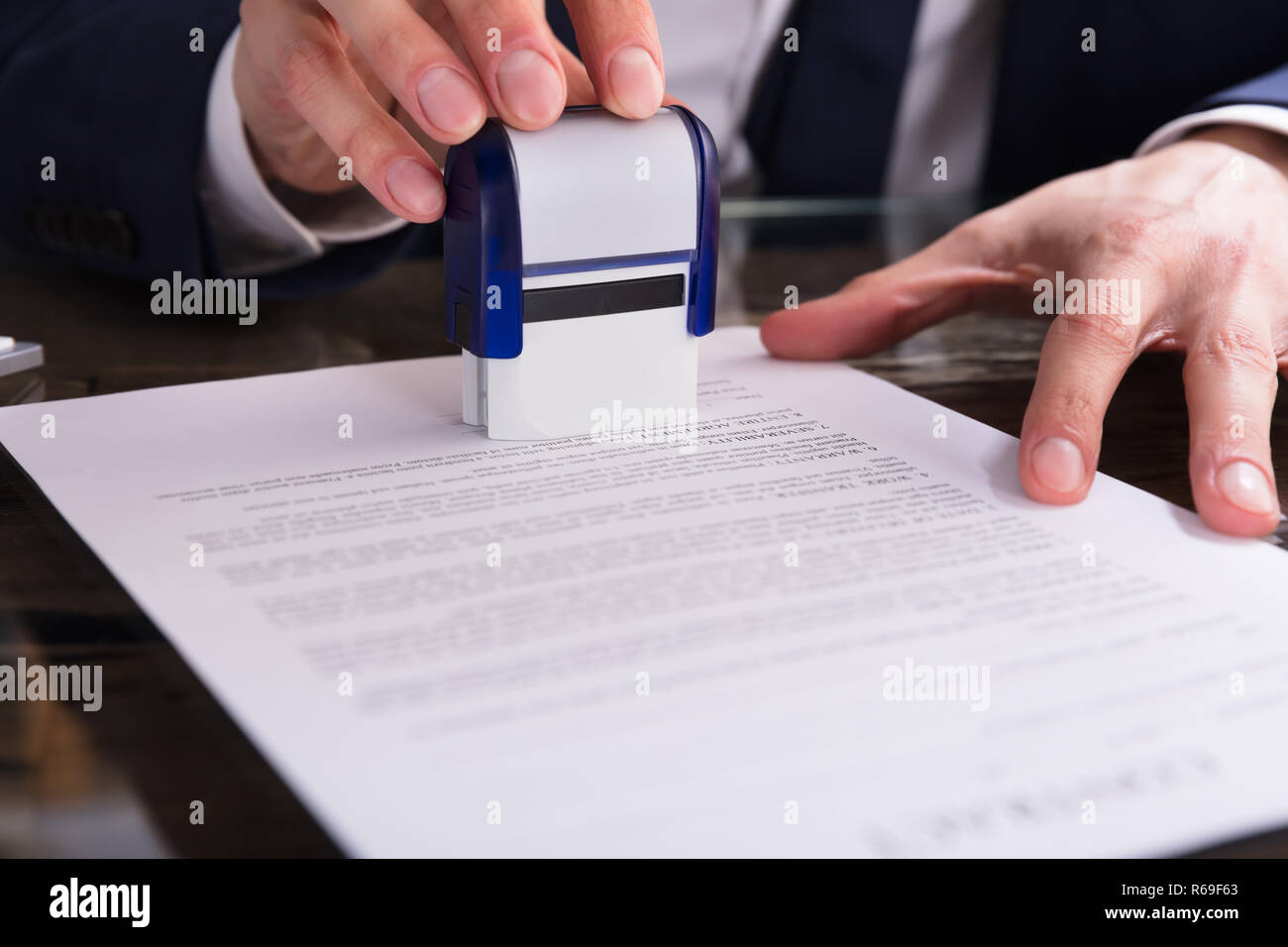 Businessperson stamping document hi-res stock photography and images ...