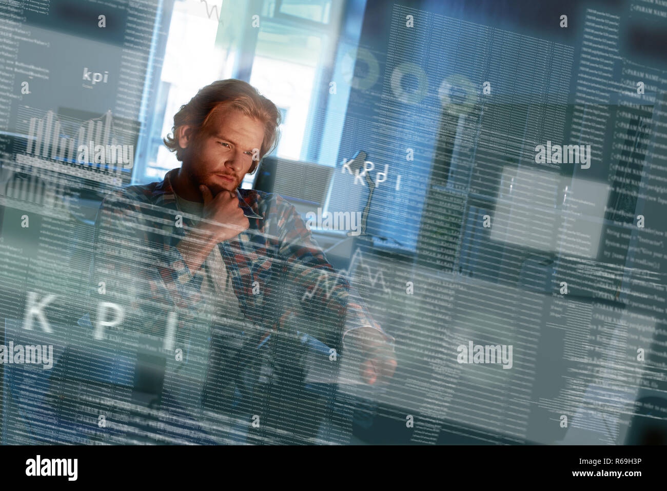 Young concentrated computer developer writing new code Stock Photo - Alamy