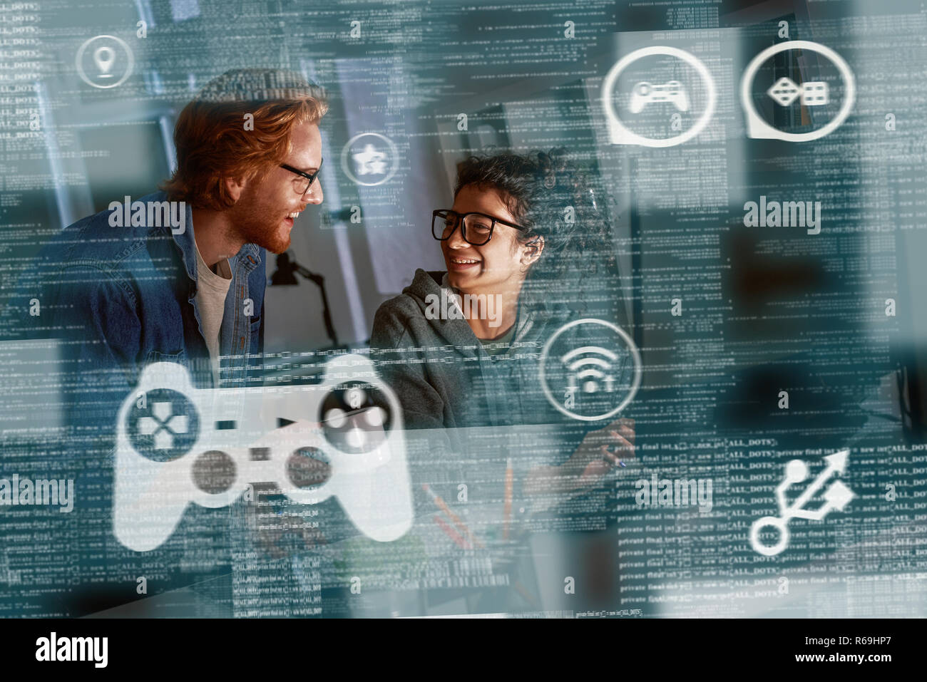 Young indian woman game developer and red haired man are laughting ...