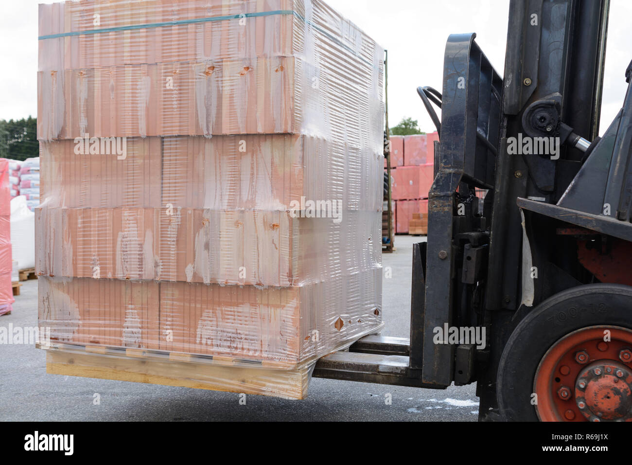 With A Forklift Pallet Brick Is Transported Stock Photo - Alamy