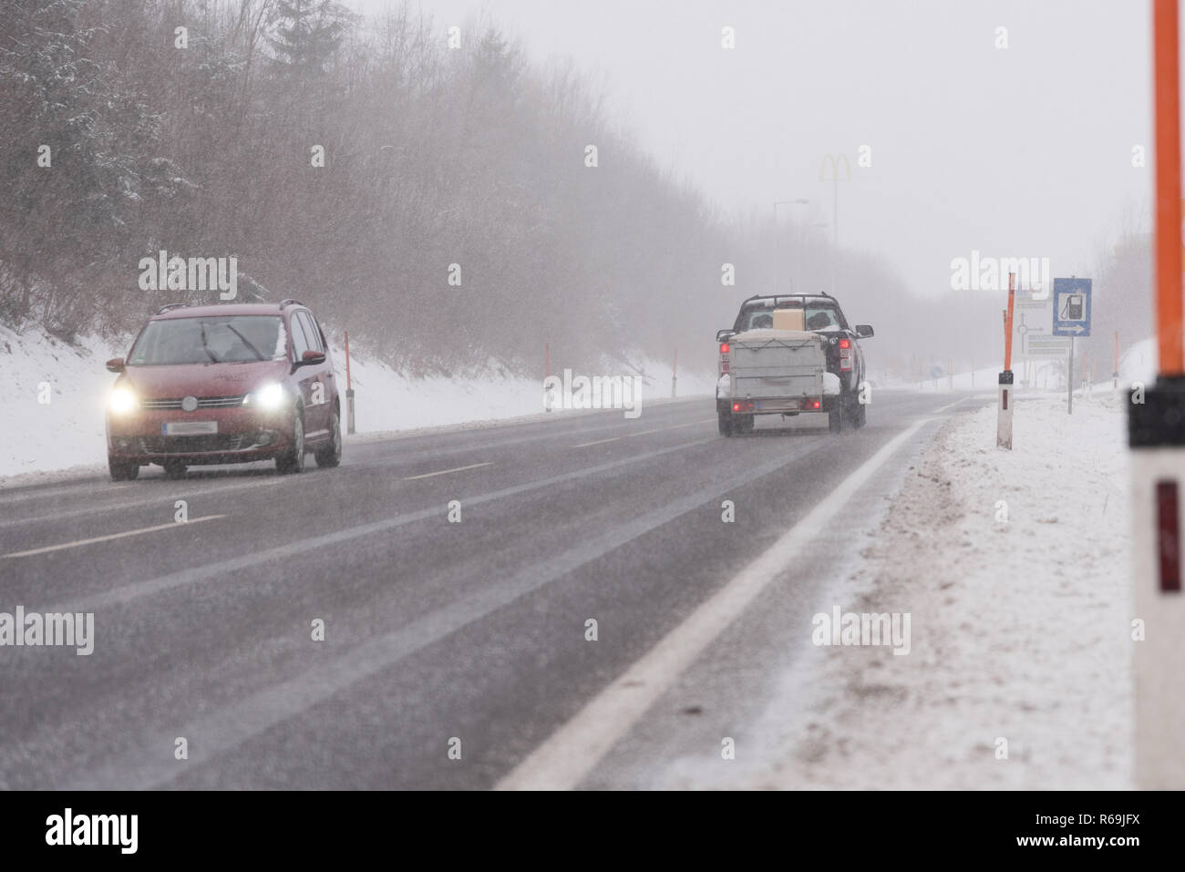 Driving With Light In Poor Visibility In Fog Stock Photo - Alamy