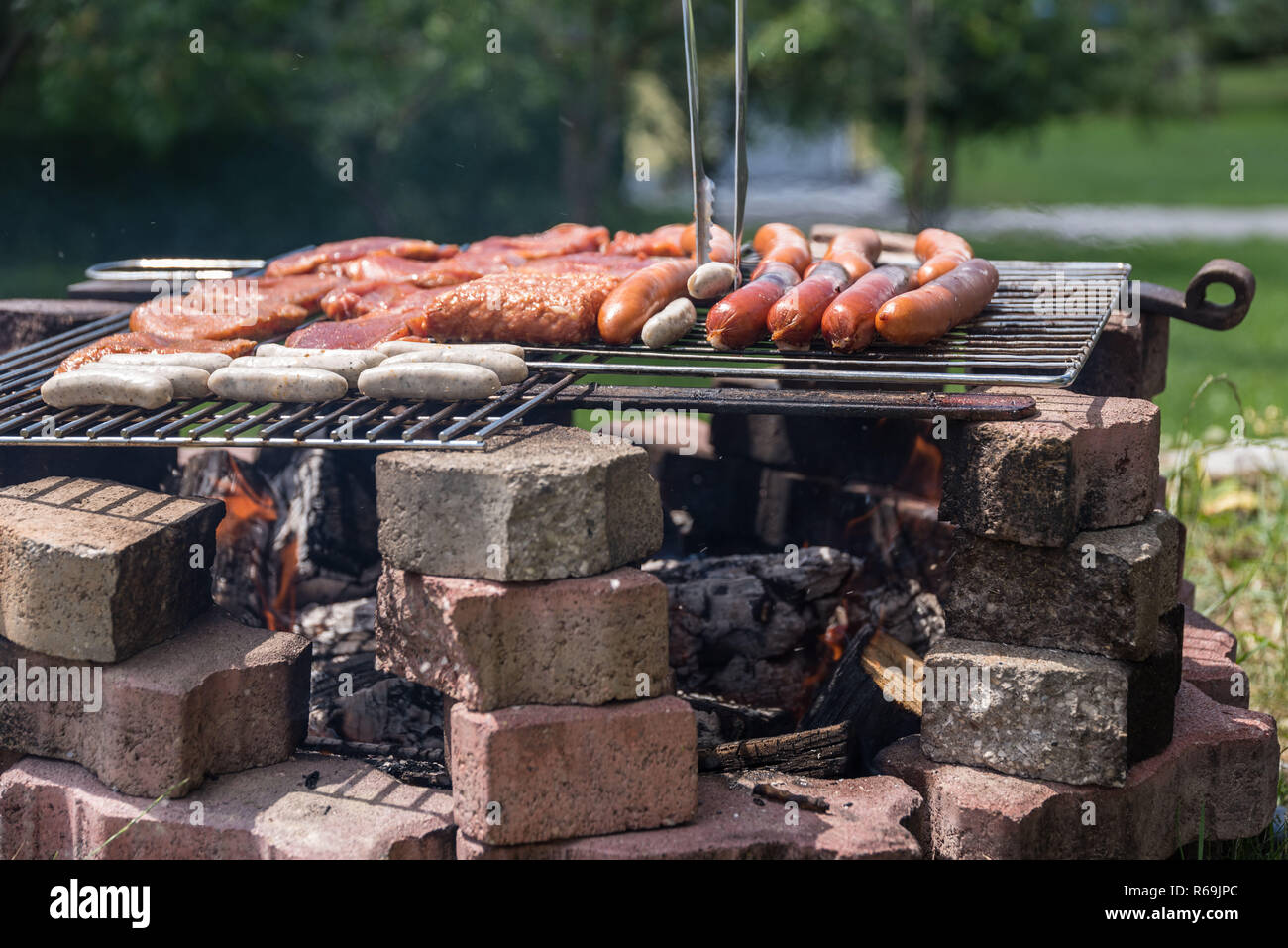Rustic Bbq With Grill Cutlet And Sausages On Grill Grate Stock Photo ...