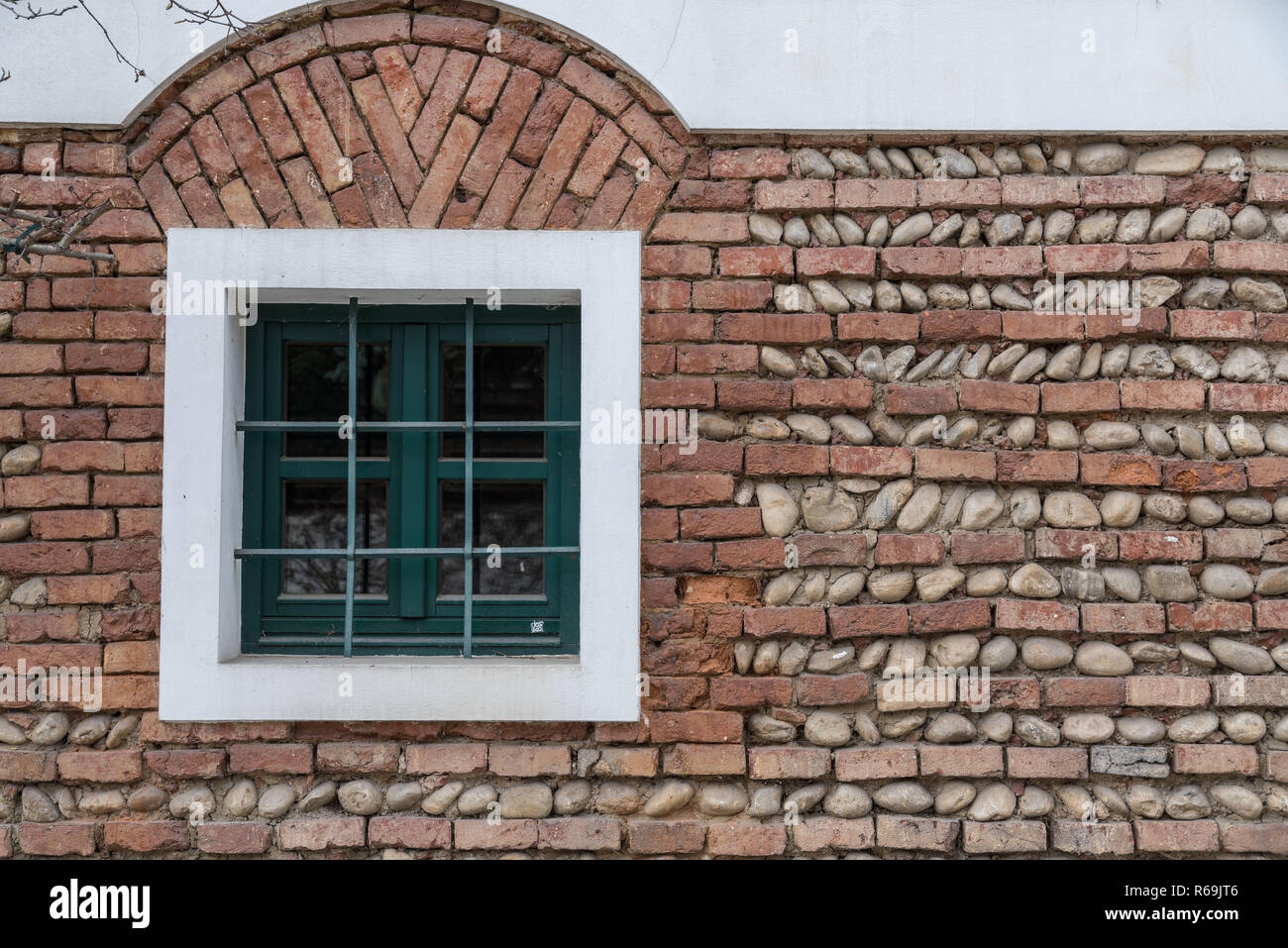 Windows With Window Bars In The Middle Of A Brick Wall Of Bricks And ...