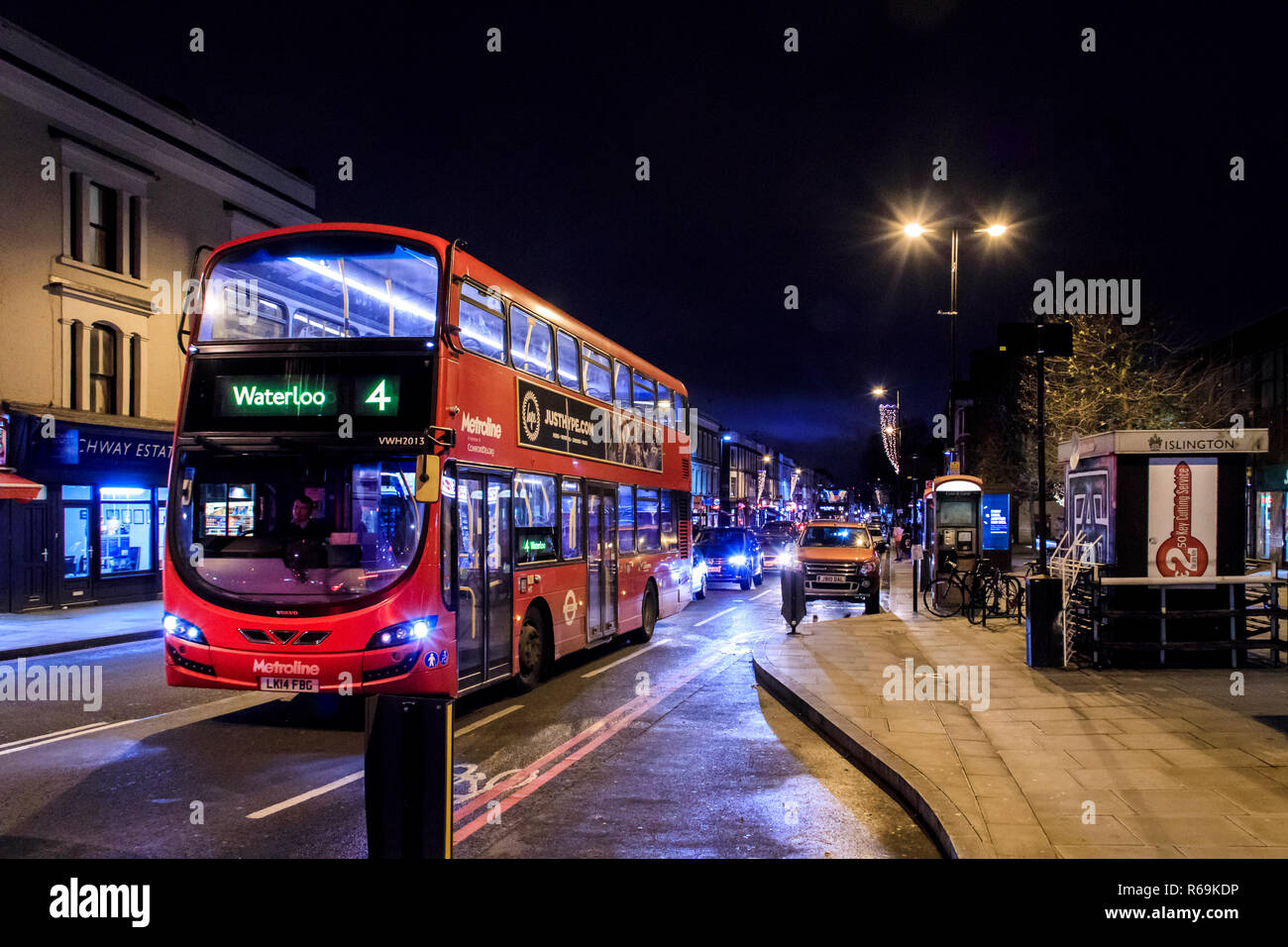 Night time urban scene of buses and traffic on Junction Road, Islington ...