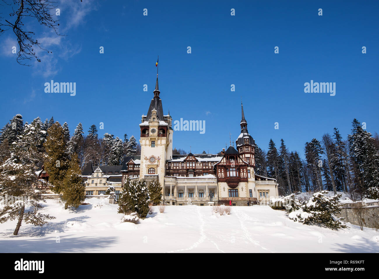 Peles castle in Romania. Beautiful, royal castle in snowy, white winter ...