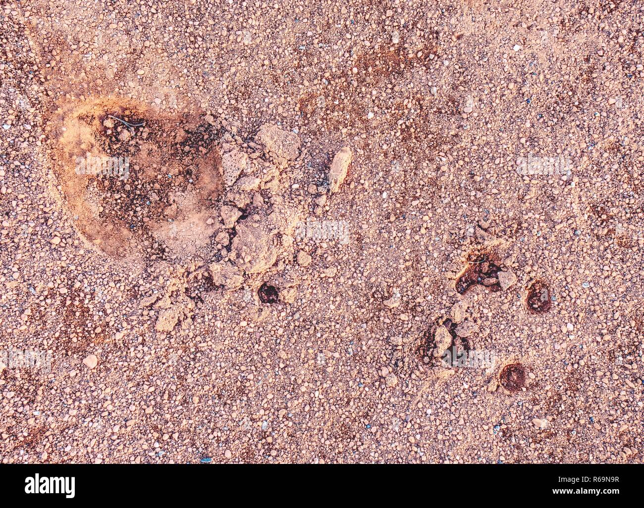 Footprint of soccer shoe in tennis court surface. Deep marks in detail ...