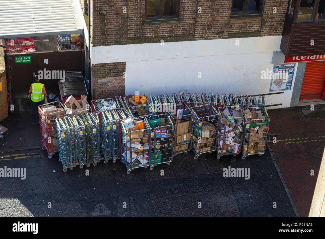 wire mesh trolleys containing waste cardboard for recycling, uk Stock ...