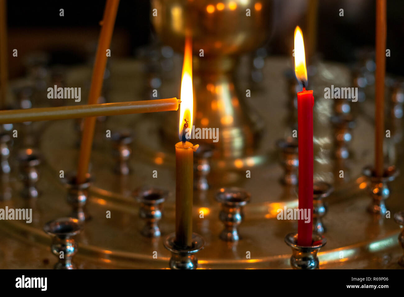 The candle is set on fire. Candles burn in the church on a special ...