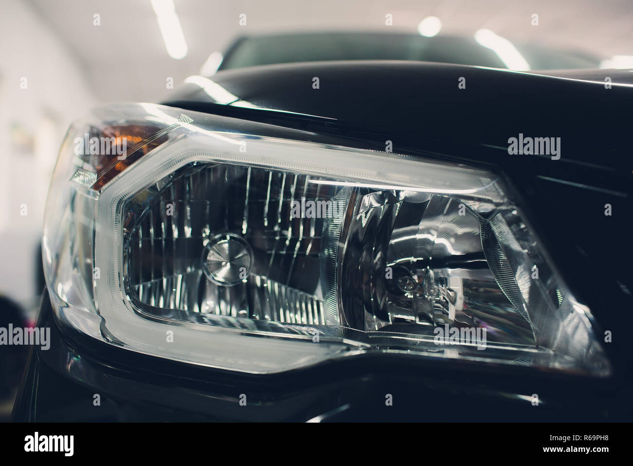 front headlight, with shiny reflections auto black body Stock Photo - Alamy