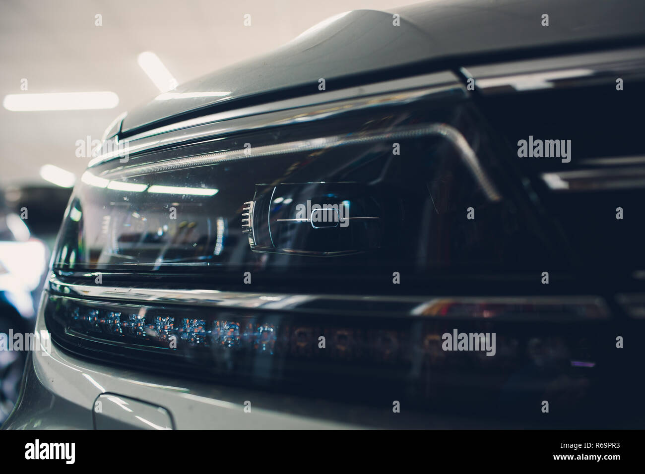 front headlight, with shiny reflections auto black body Stock Photo - Alamy