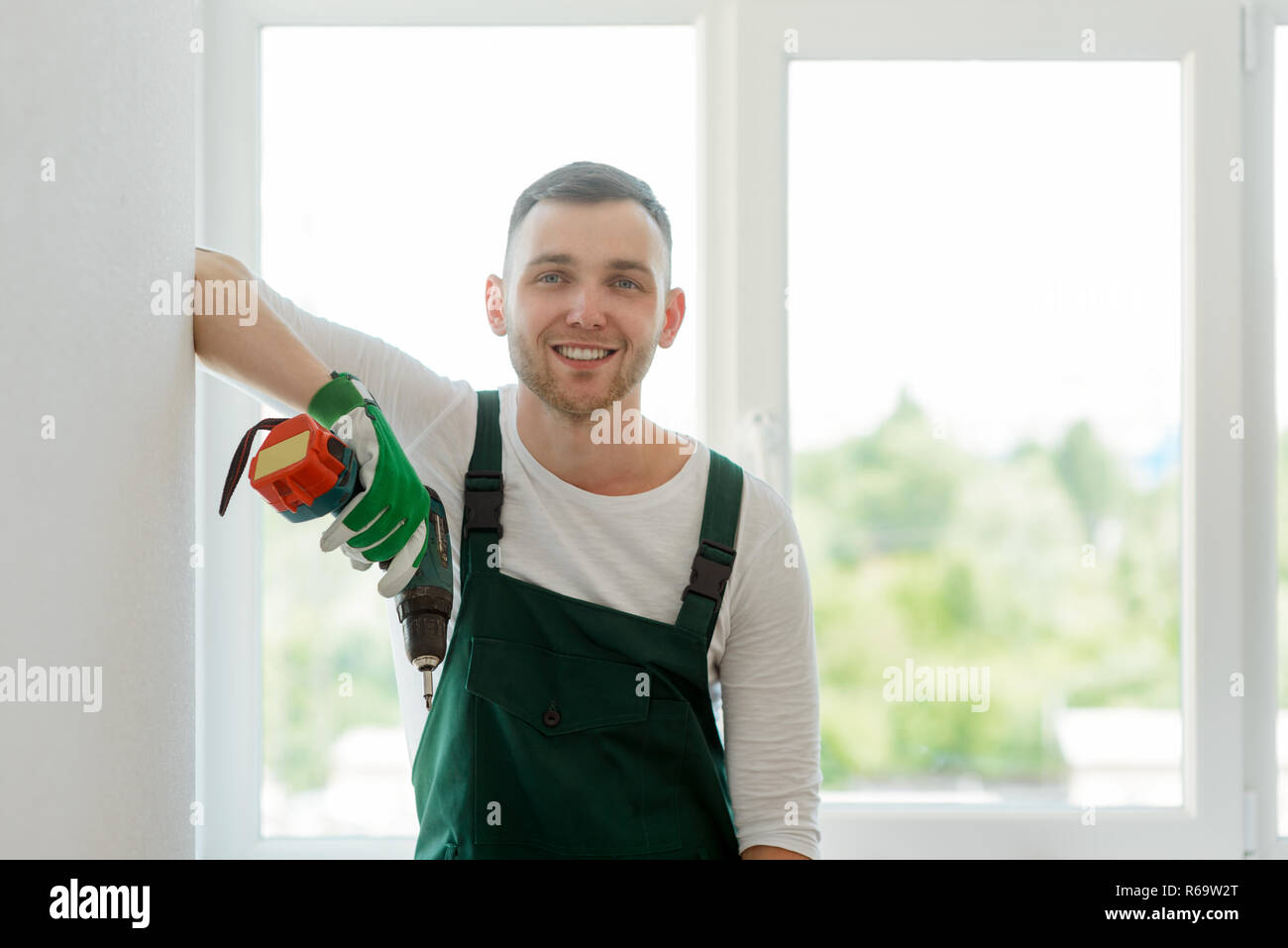 Cheerful male employee holding hi-res stock photography and images - Alamy
