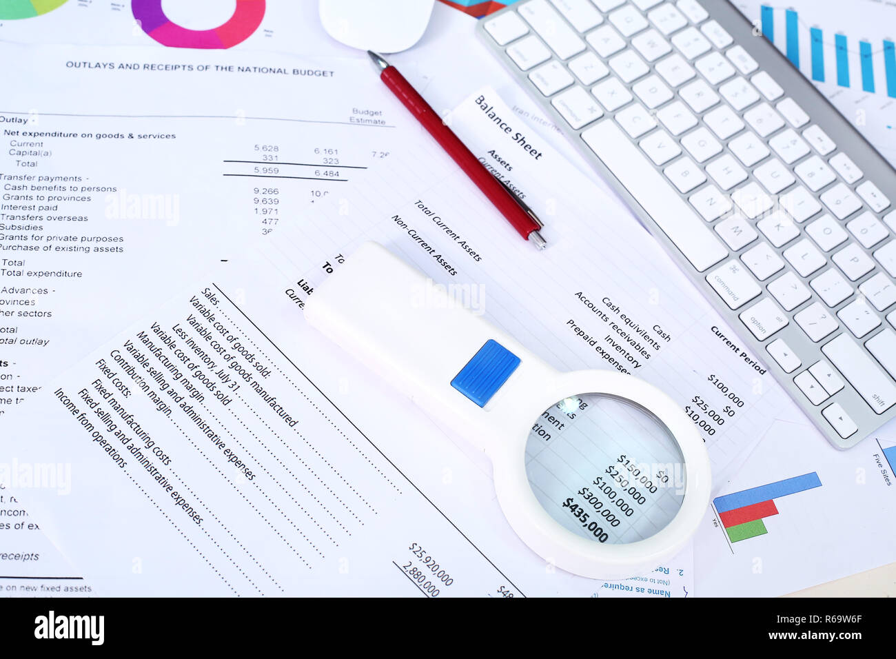 Portrait of account sheet, pen, keyboard, magnifying glass and mouse ...