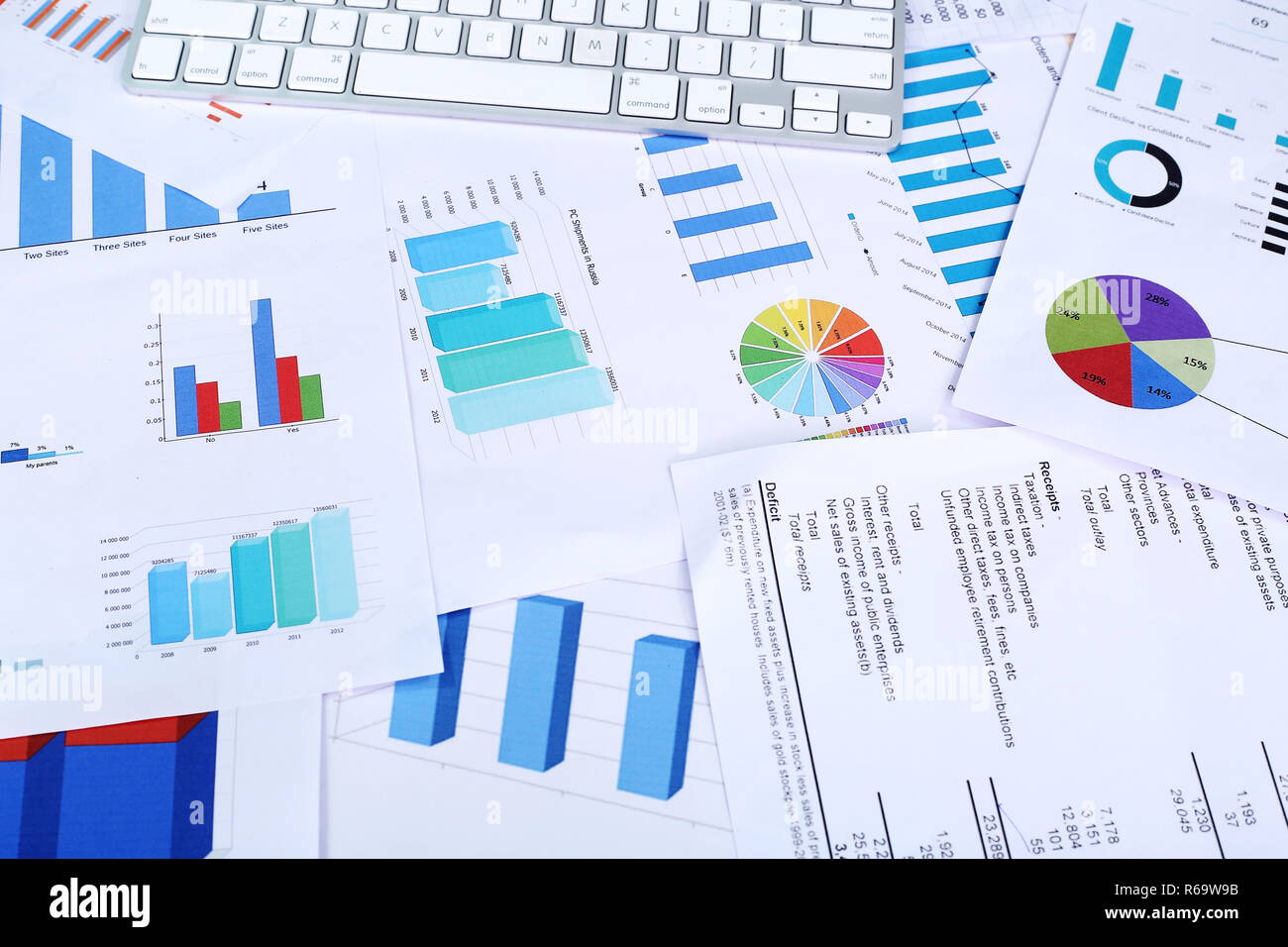 Portrait of financial graph paper and keyboard Stock Photo - Alamy