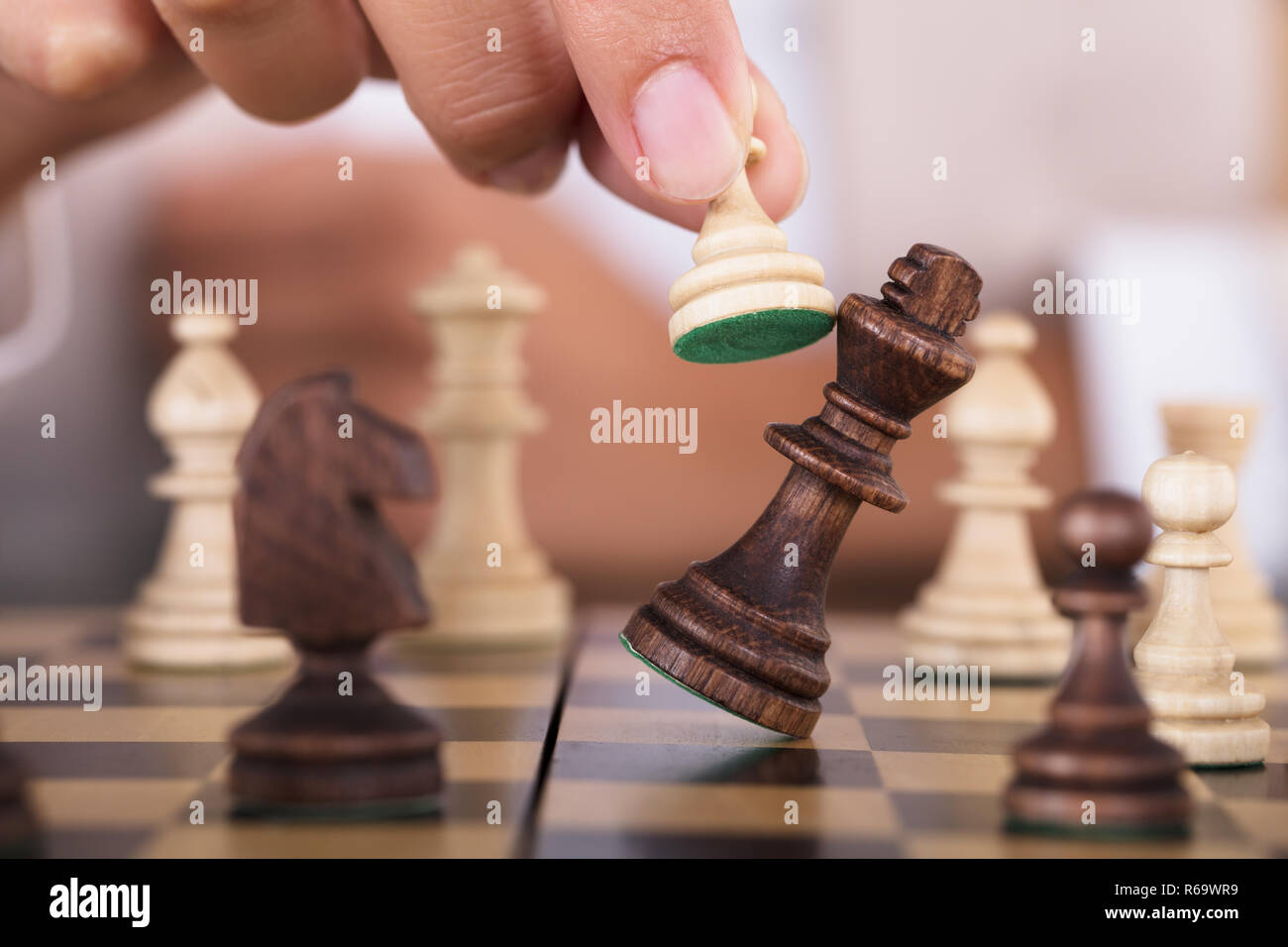 Hand Playing Chess And Falling King Stock Photo - Alamy