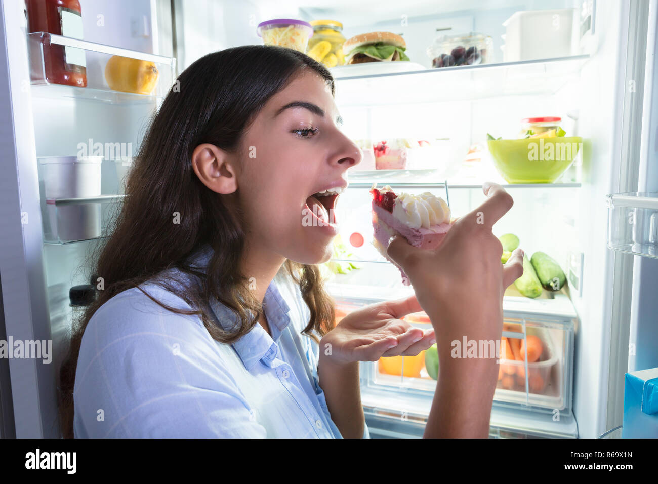 Close-up Of A Woman Eating Slice Of Cake Stock Photo - Alamy