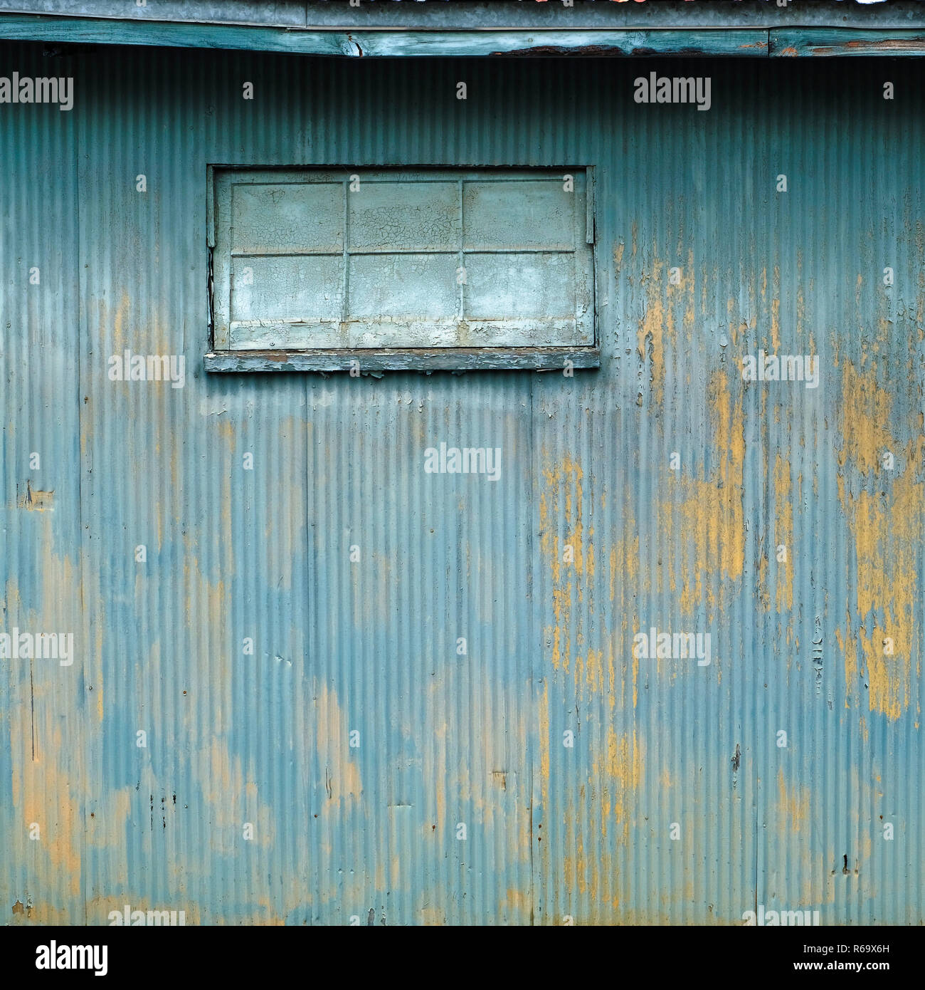 Metal wall and painted windows of abandoned factory. Lexington, NC ...