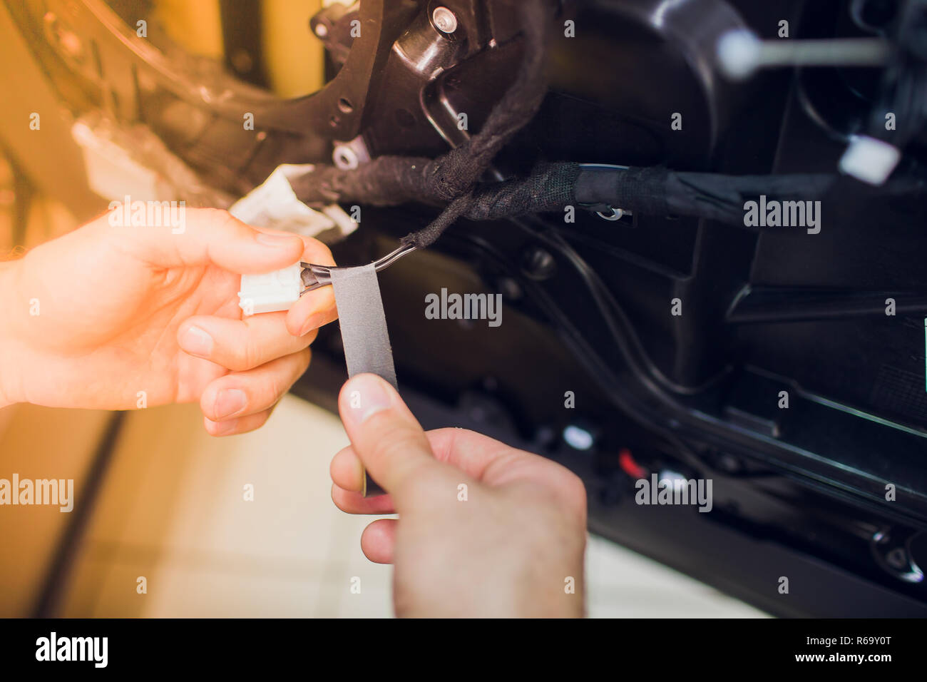 Mechanic installing car central door lock motor Stock Photo - Alamy