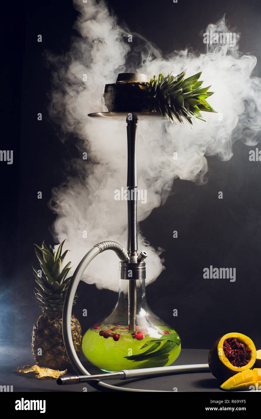 Hookah hot coals on shisha bowl with black background. Stylish oriental ...