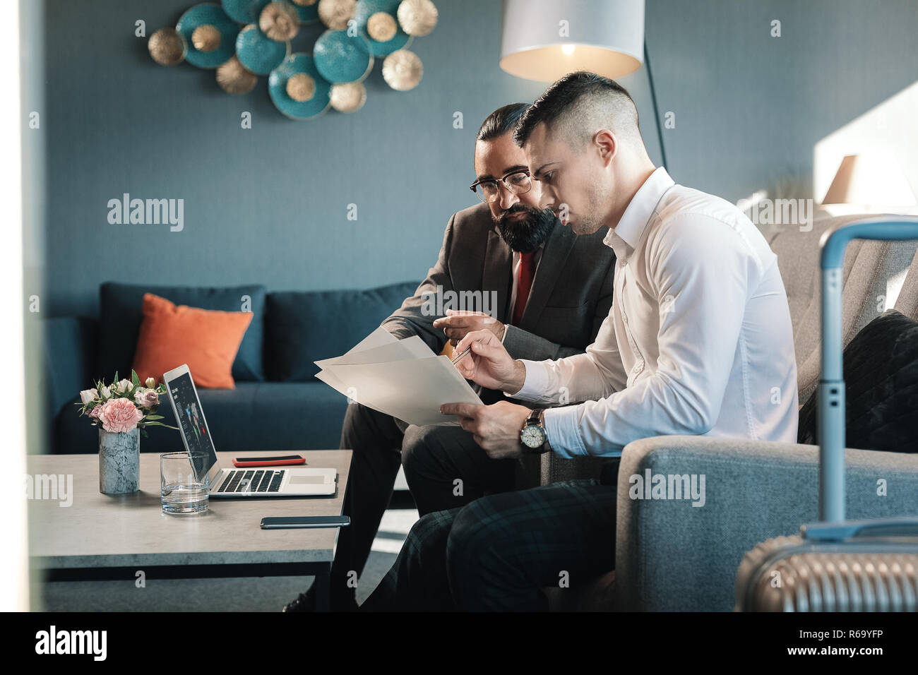 Two business partners discussing some financial issues together Stock ...