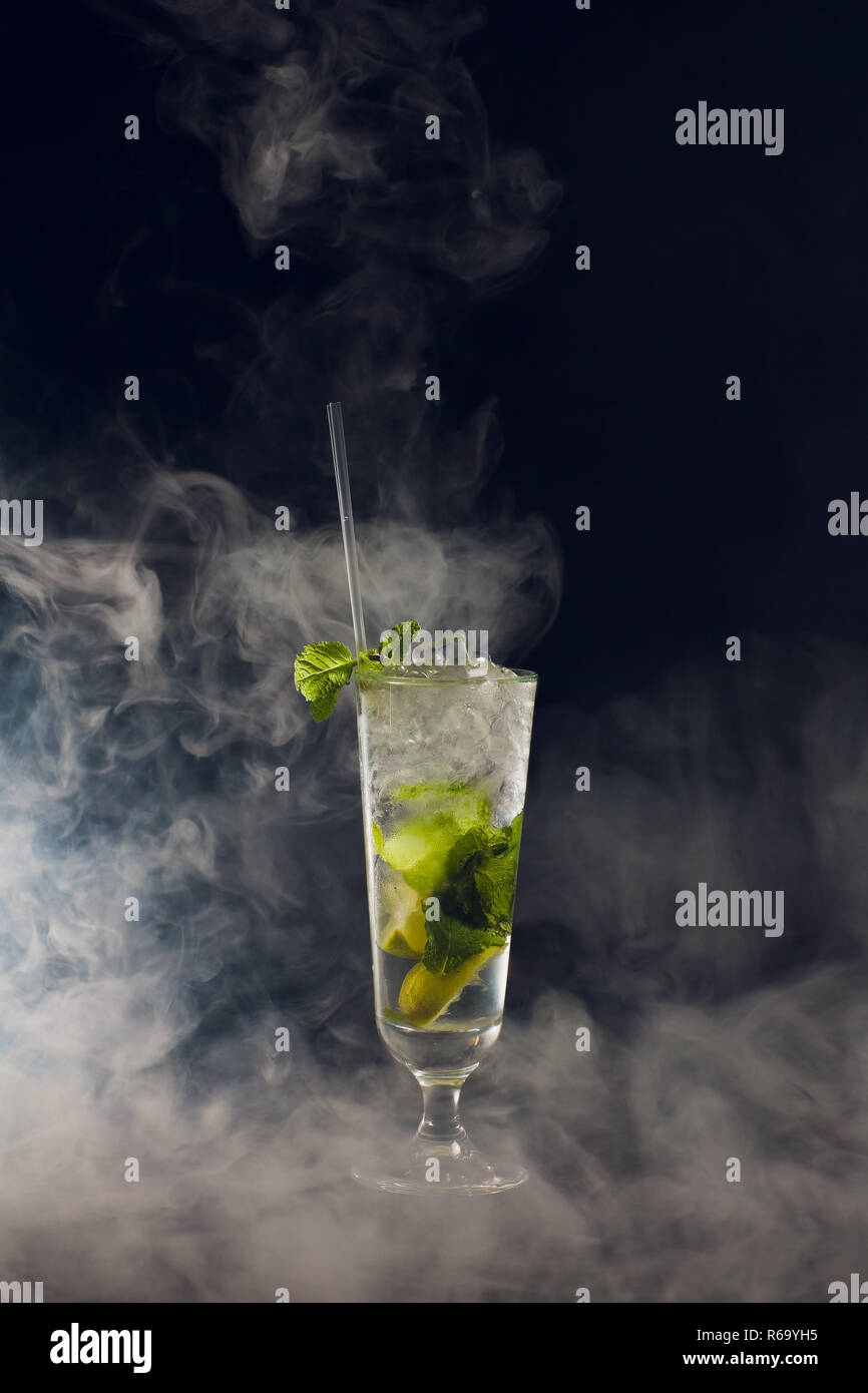 Beautiful cocktail isolated with dry ice smoke Stock Photo - Alamy