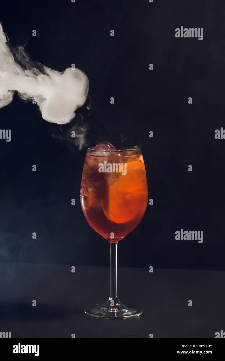 Beautiful cocktail isolated with dry ice smoke Stock Photo - Alamy