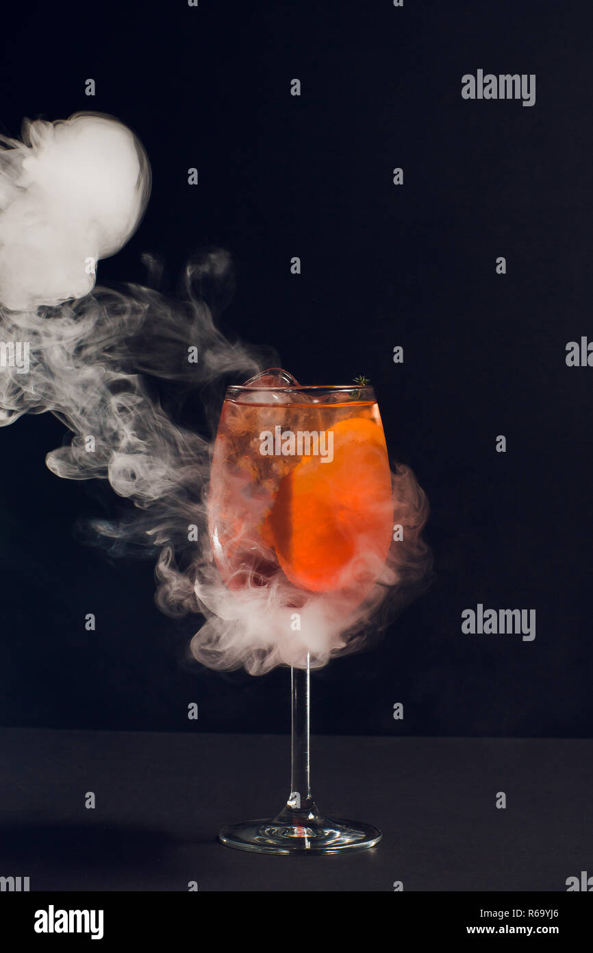 Beautiful cocktail isolated with dry ice smoke Stock Photo - Alamy