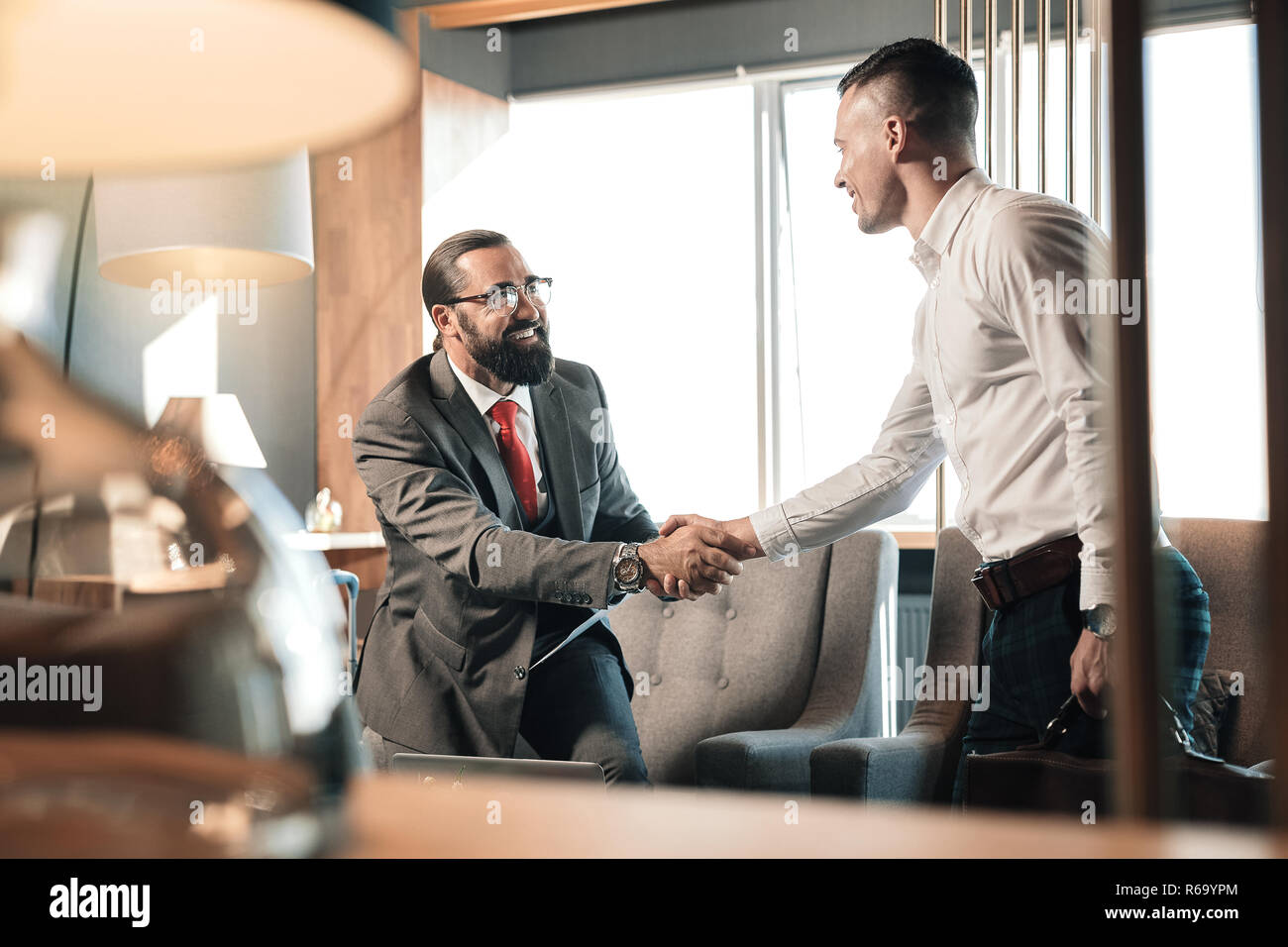 Young handsome man wearing white shirt coming to business interview ...